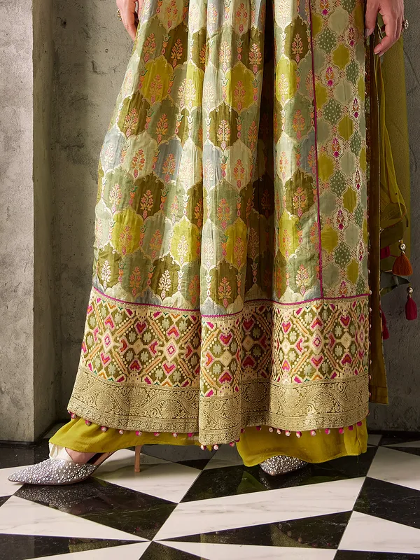 Floor-length mehendi silk palazzo suit with majestic...