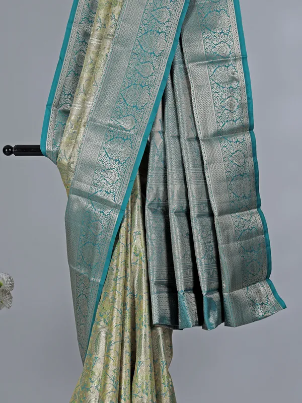 Light olive floral kanjivaram silk contrast border...