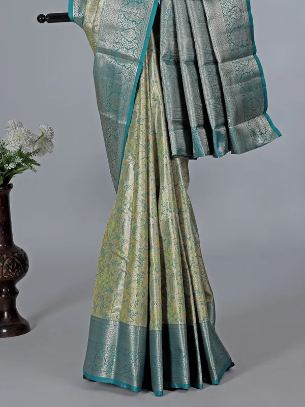 Light olive floral kanjivaram silk contrast border...