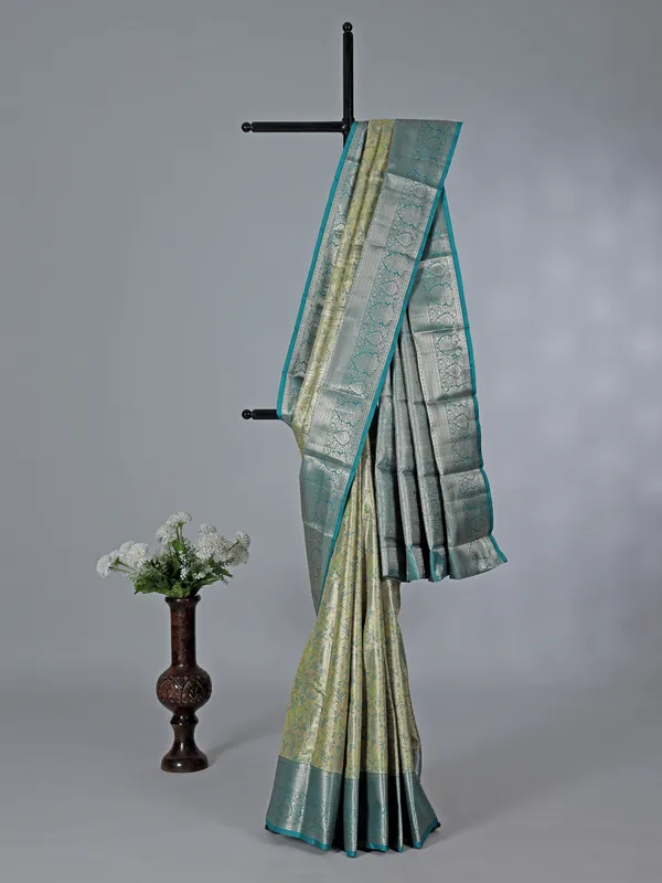 Light olive floral kanjivaram silk contrast border...