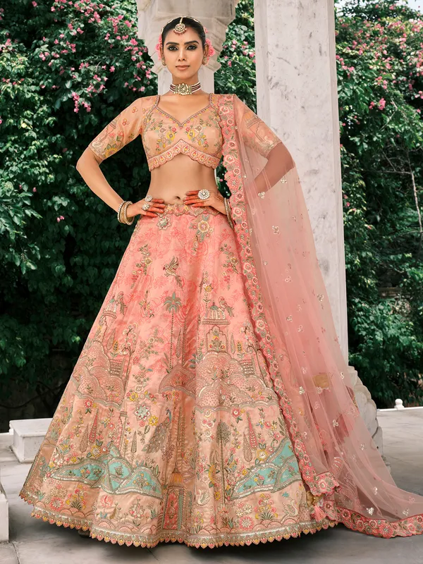 Peach silk lehenga choli for wedding with embroidery...