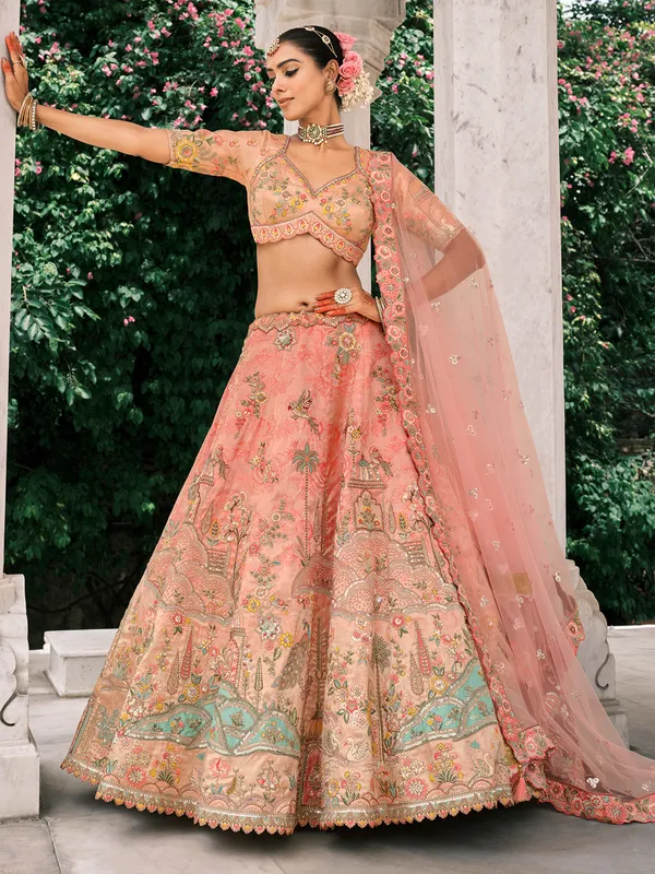 Peach silk lehenga choli for wedding with embroidery...