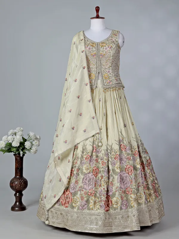 Beige silk U neck embroidered lehenga choli with...