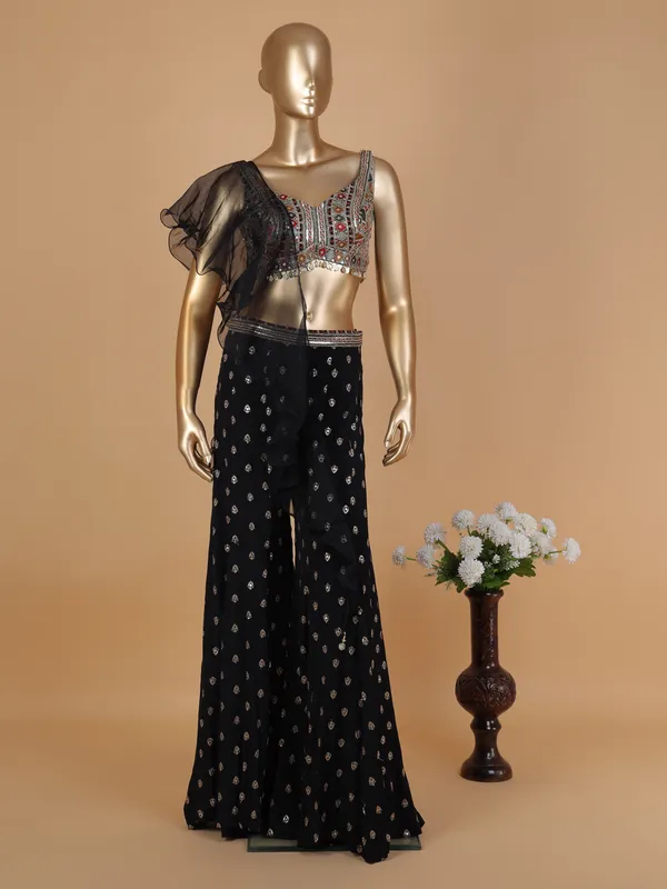 Latest black georgette palazzo suit with ruffle...